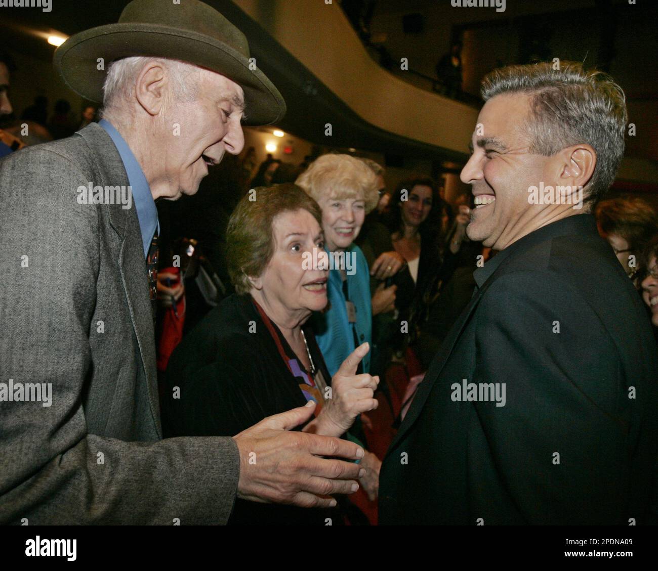 George Clooney, right, talks with Joe Wershba and his wife Shirley ...