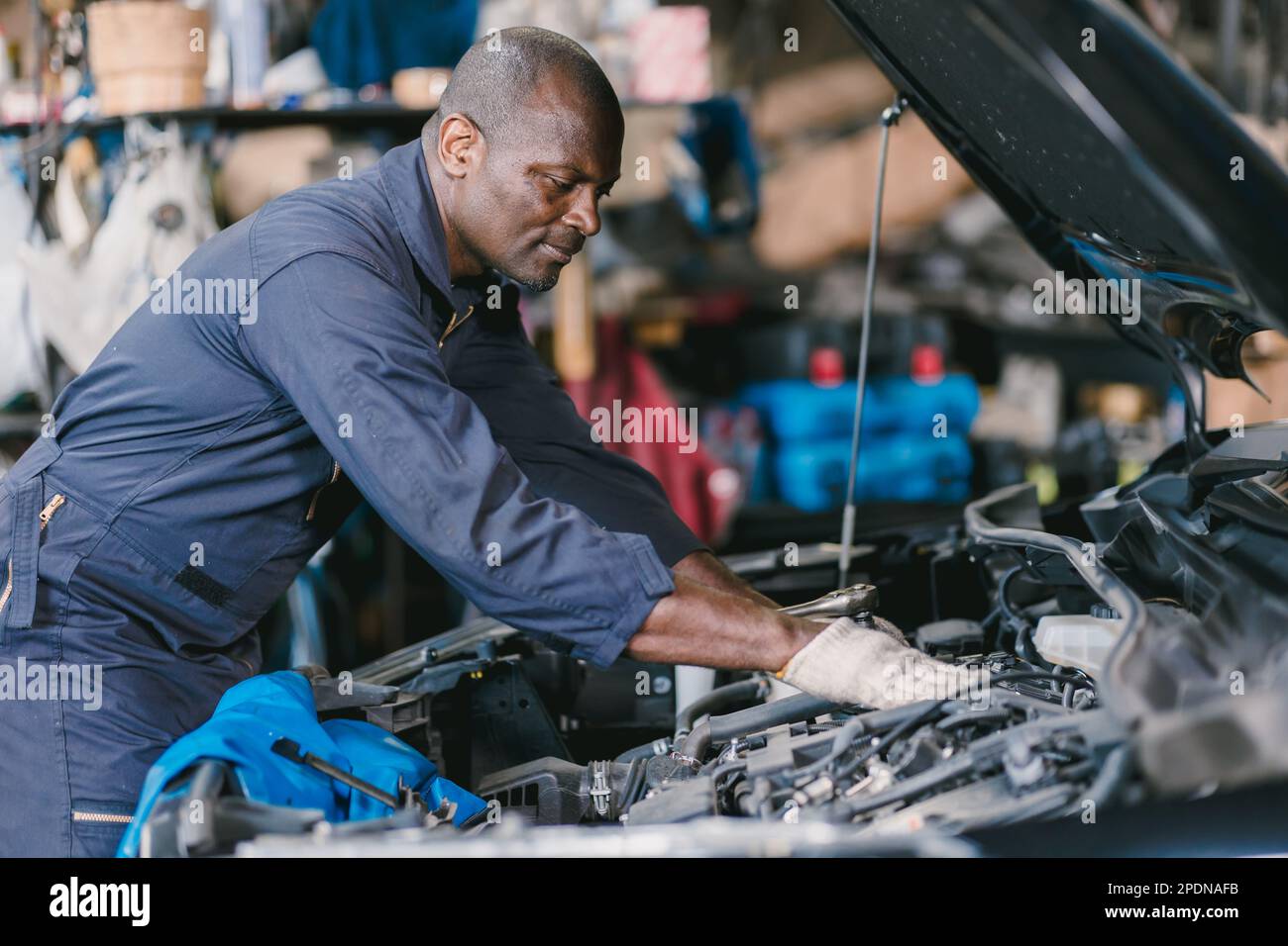 Garage Mechanic African Black male professional working car auto ...