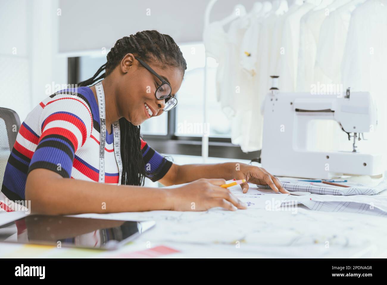 Happy African black woman working as Tailor Clothes Designer enjoy ...