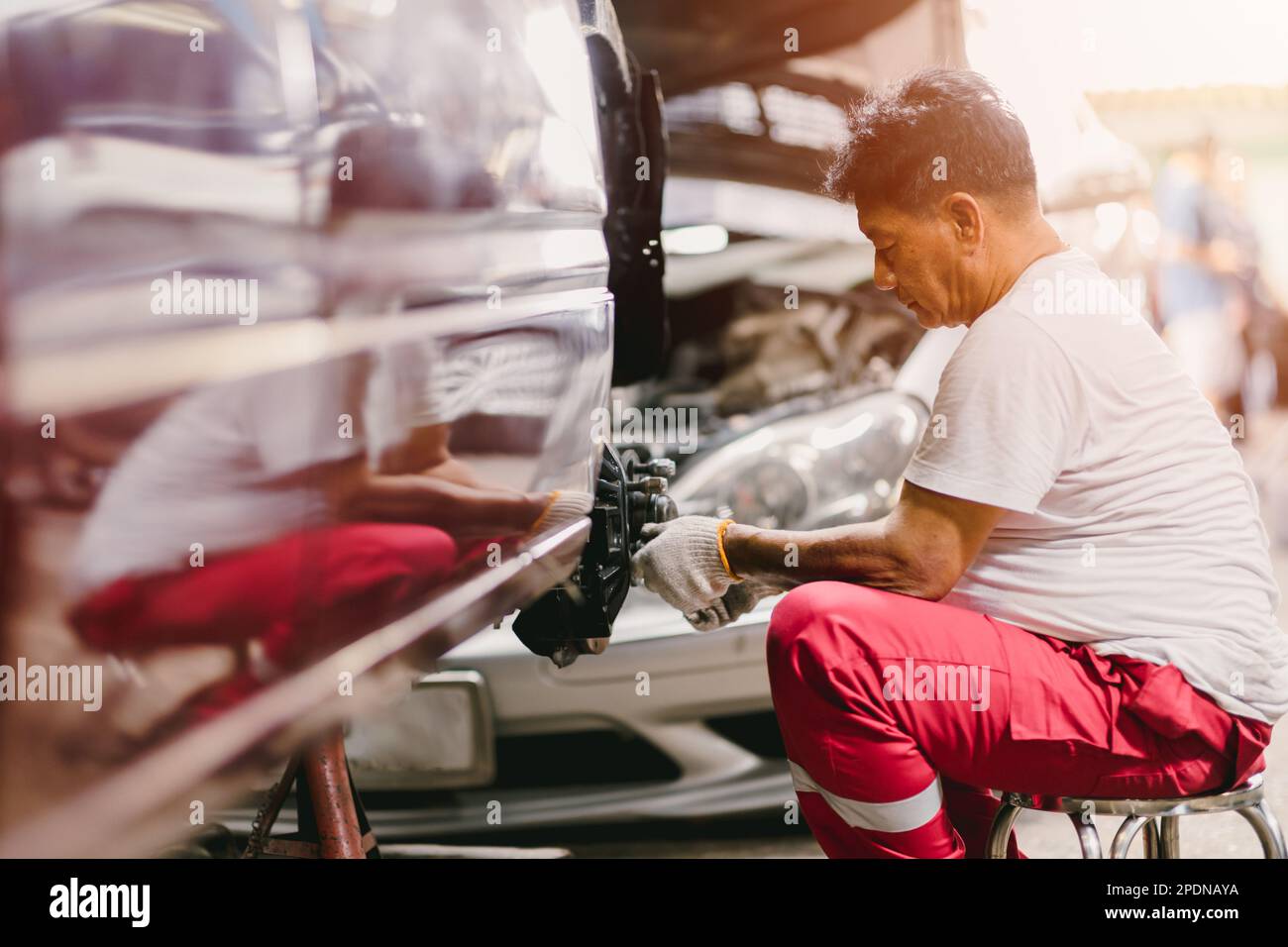 Garage Mechanic service staff working fix replace cleaning braking ...