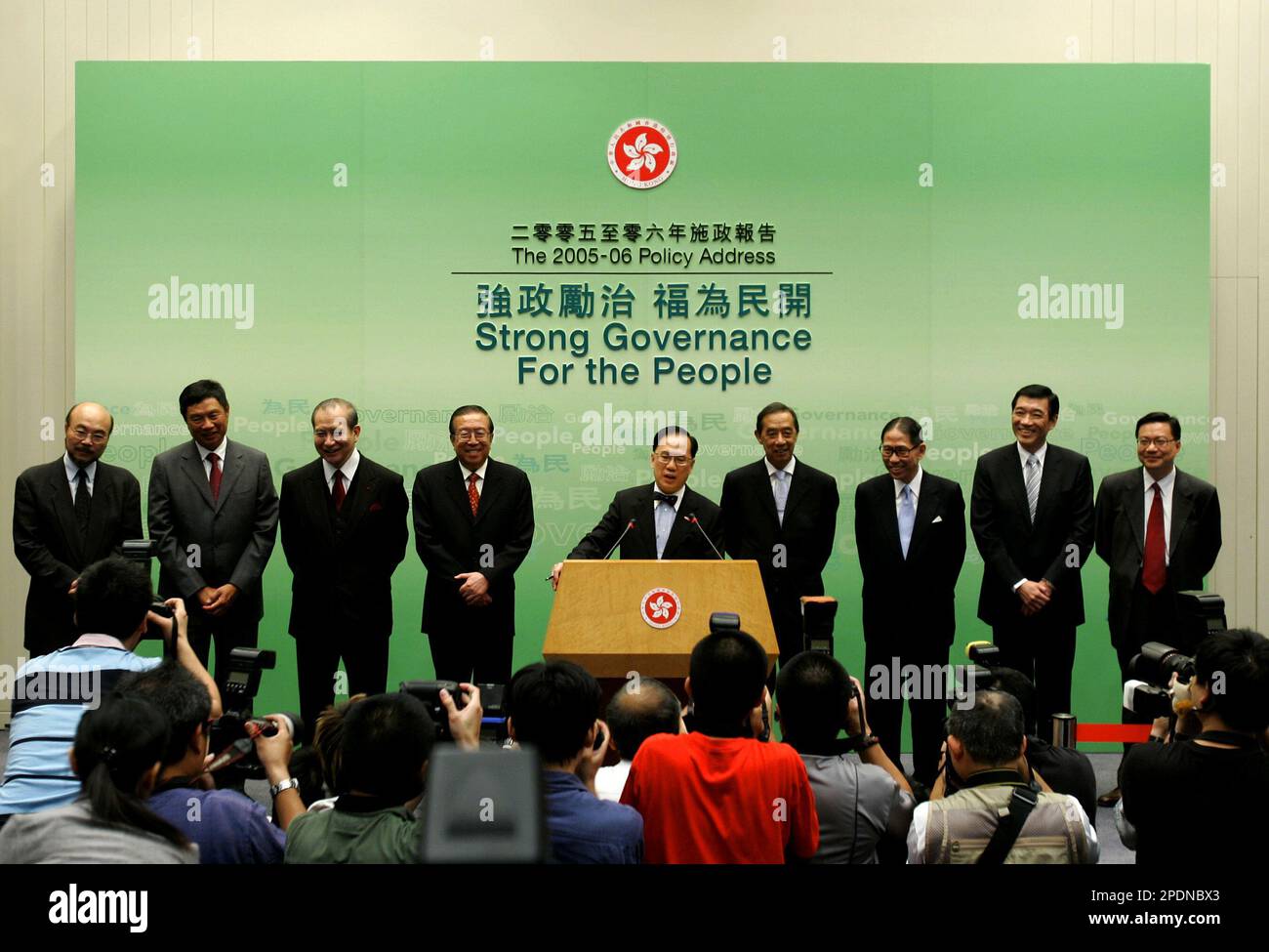 Hong Kong's new leader, Chief Executive Donald Tsang, center, announces ...