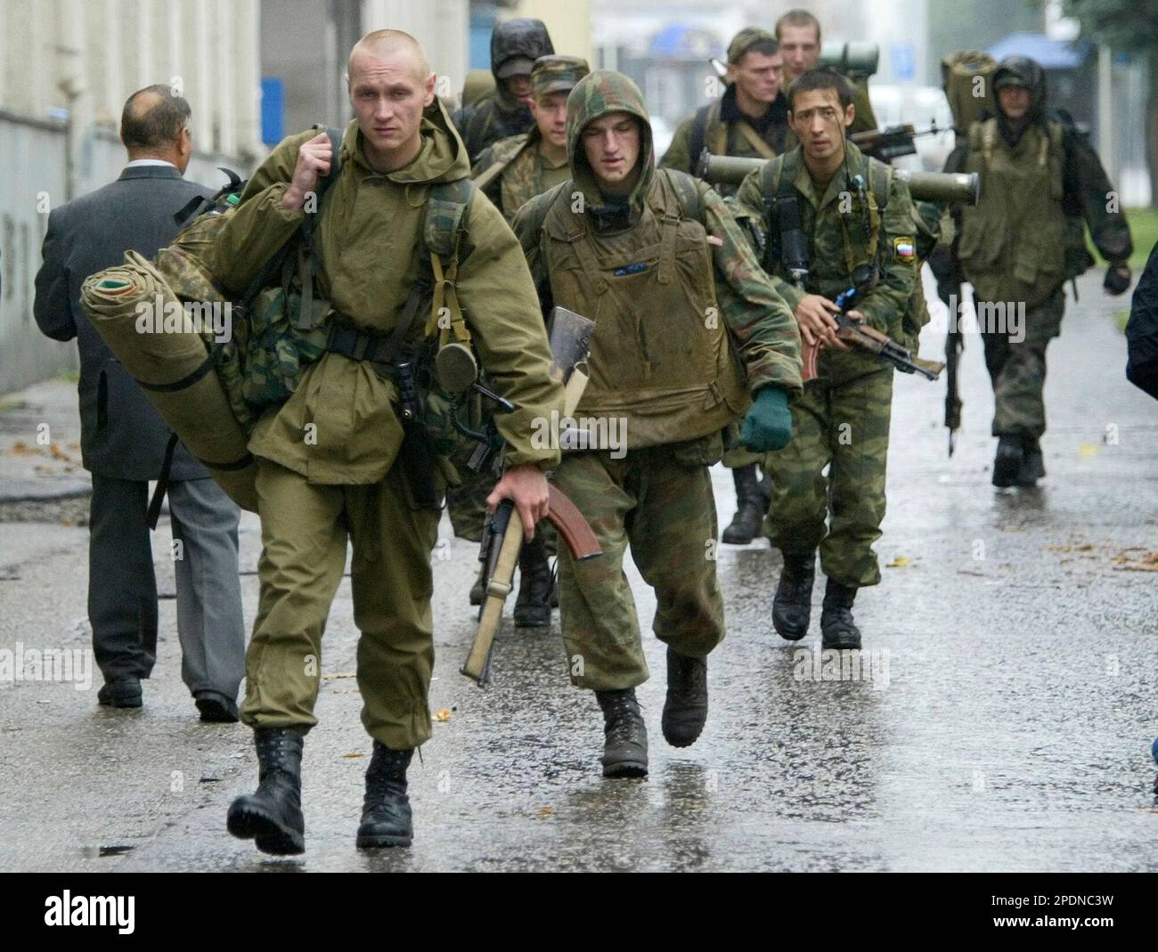 Russian Interior Ministry troops walk with their belongings in Nalchik ...