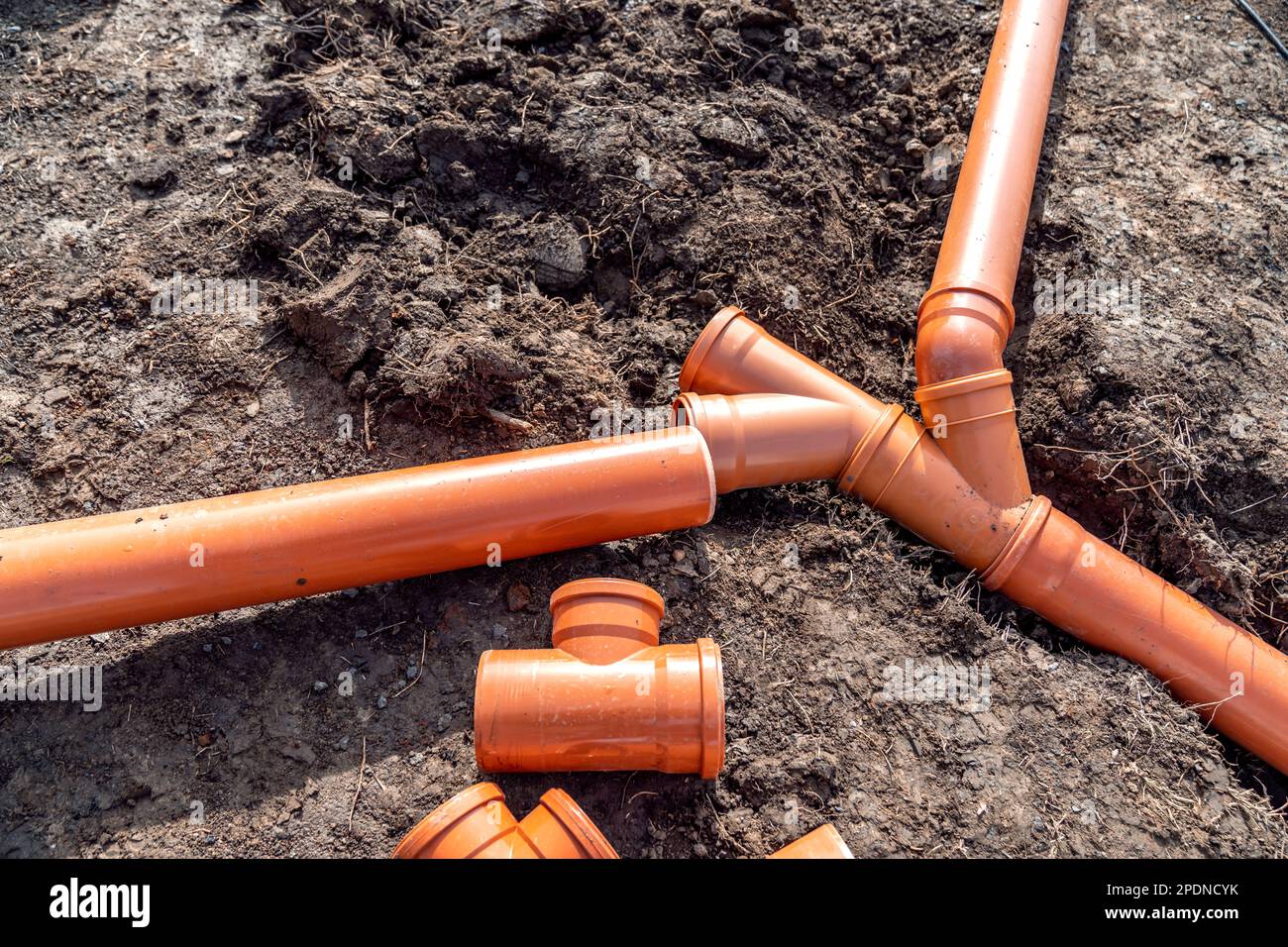 plastic PVC pipe system for water and waste in the ground Stock Photo ...