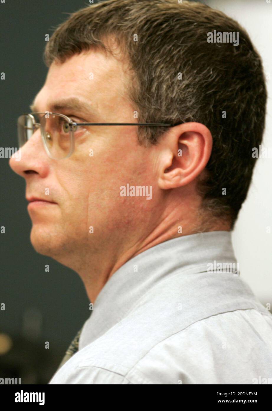 Defendant James E. Trimble listens to testimony during his triple ...