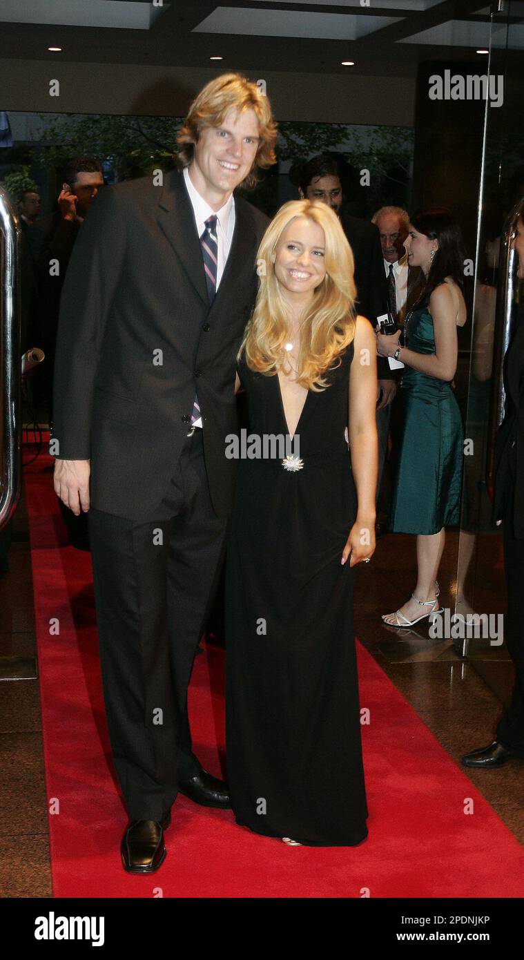 Australia's Nathan Bracken, left, and his wife Haley arrive at the IIC ...