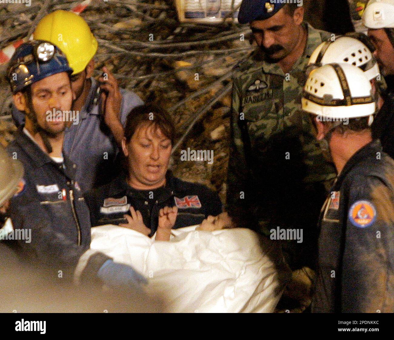 ** EDS RECROP OF MSC109 ** A woman, center, of the British 'RAPID UK ...