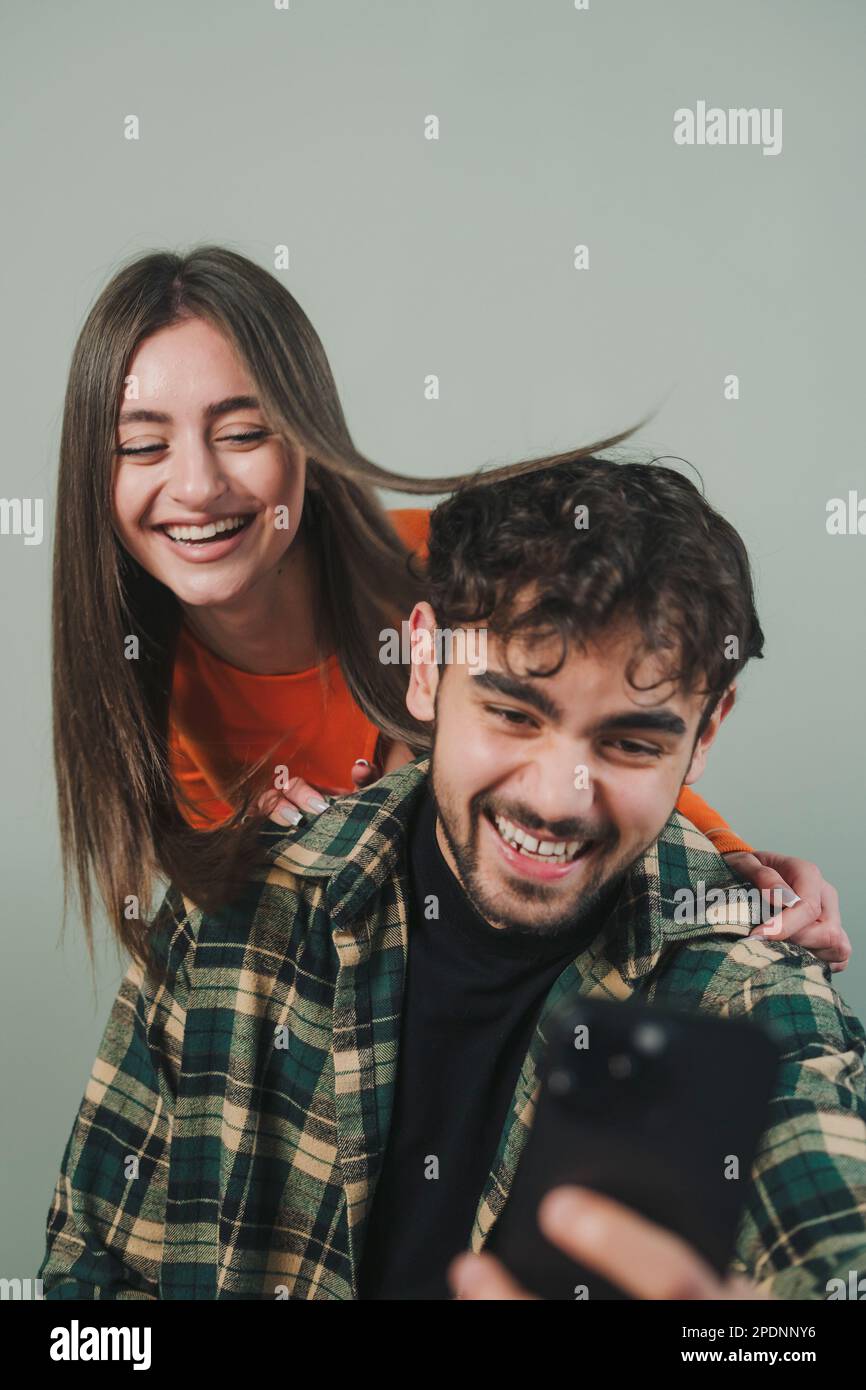 Caucasian man and woman influencers recording live video camera ...