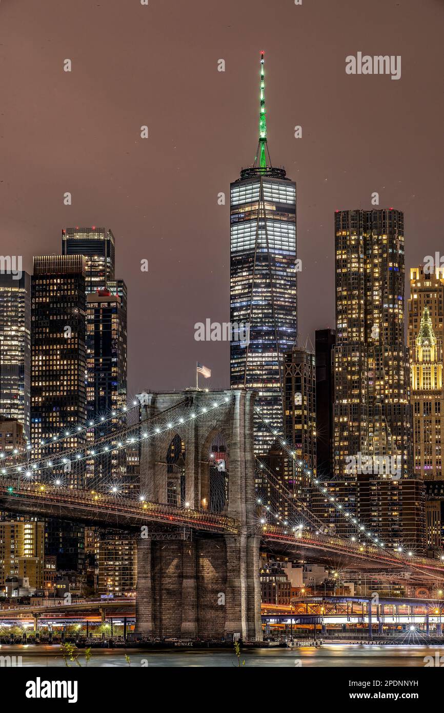 The Brooklyn Bridge illuminated with lights at night on the background ...