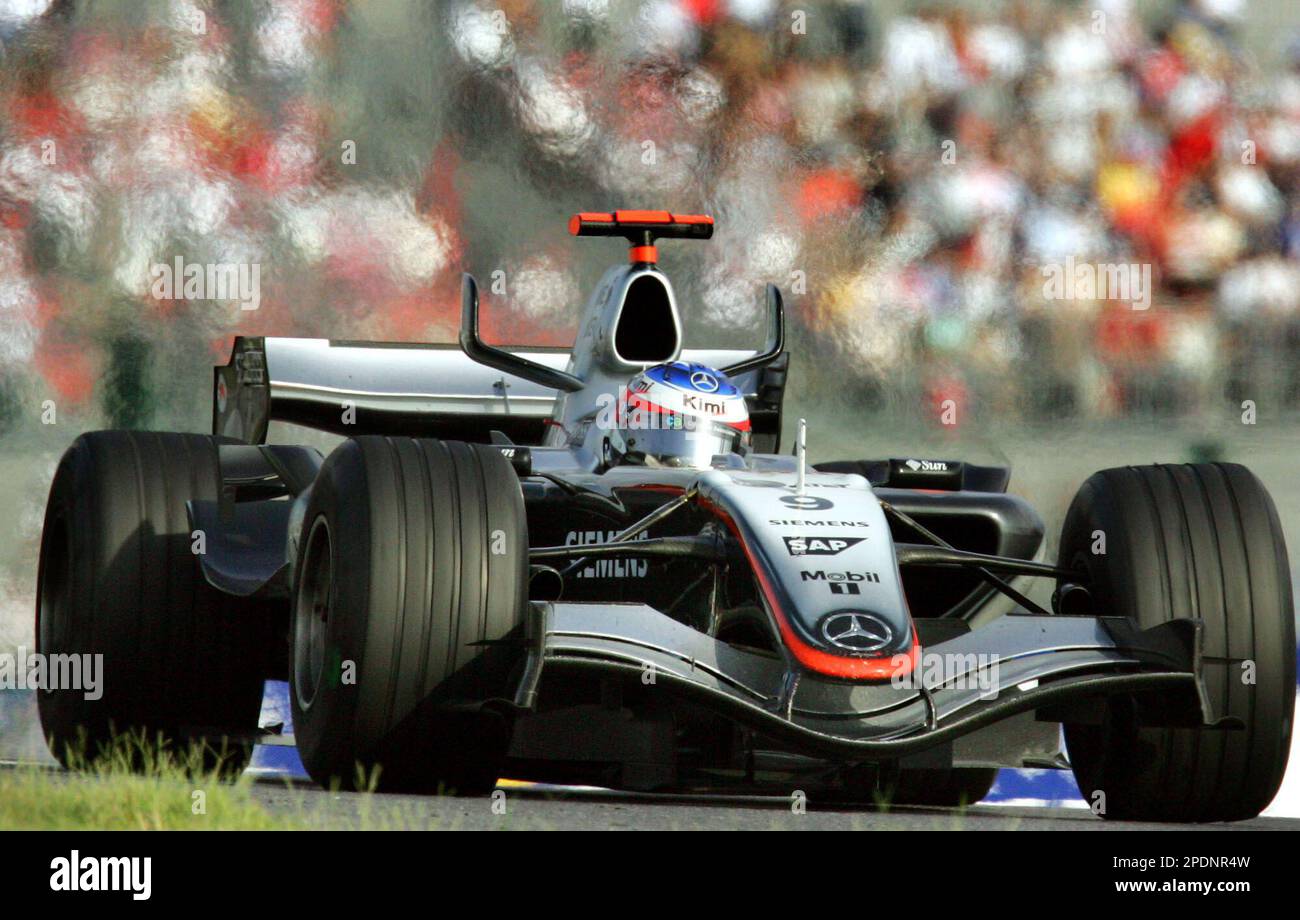 Finnish driver Kimi Raikkonen steers his McLaren-Mercedes on the way to ...