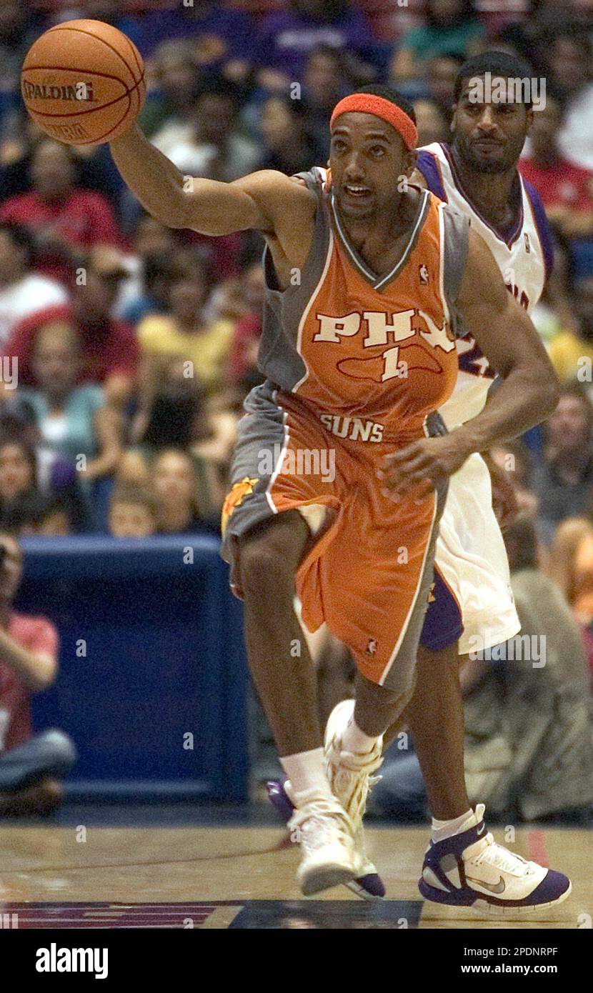 Phoenix Suns' Dijon Thompson (1) tries to control his dribble while ...