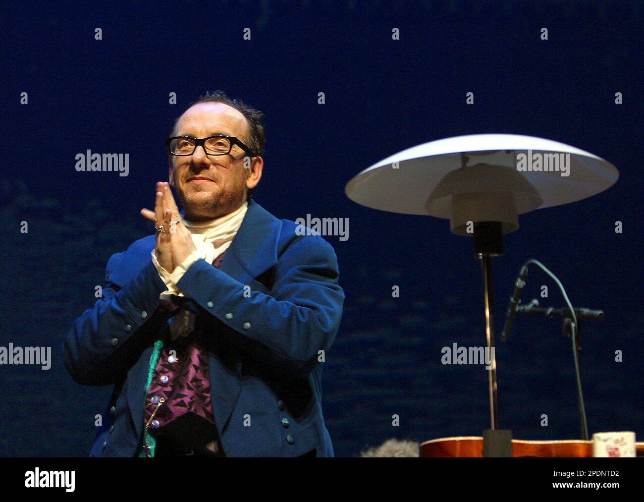 Musician Elvis Costello acknowledges the raucous applause received ...