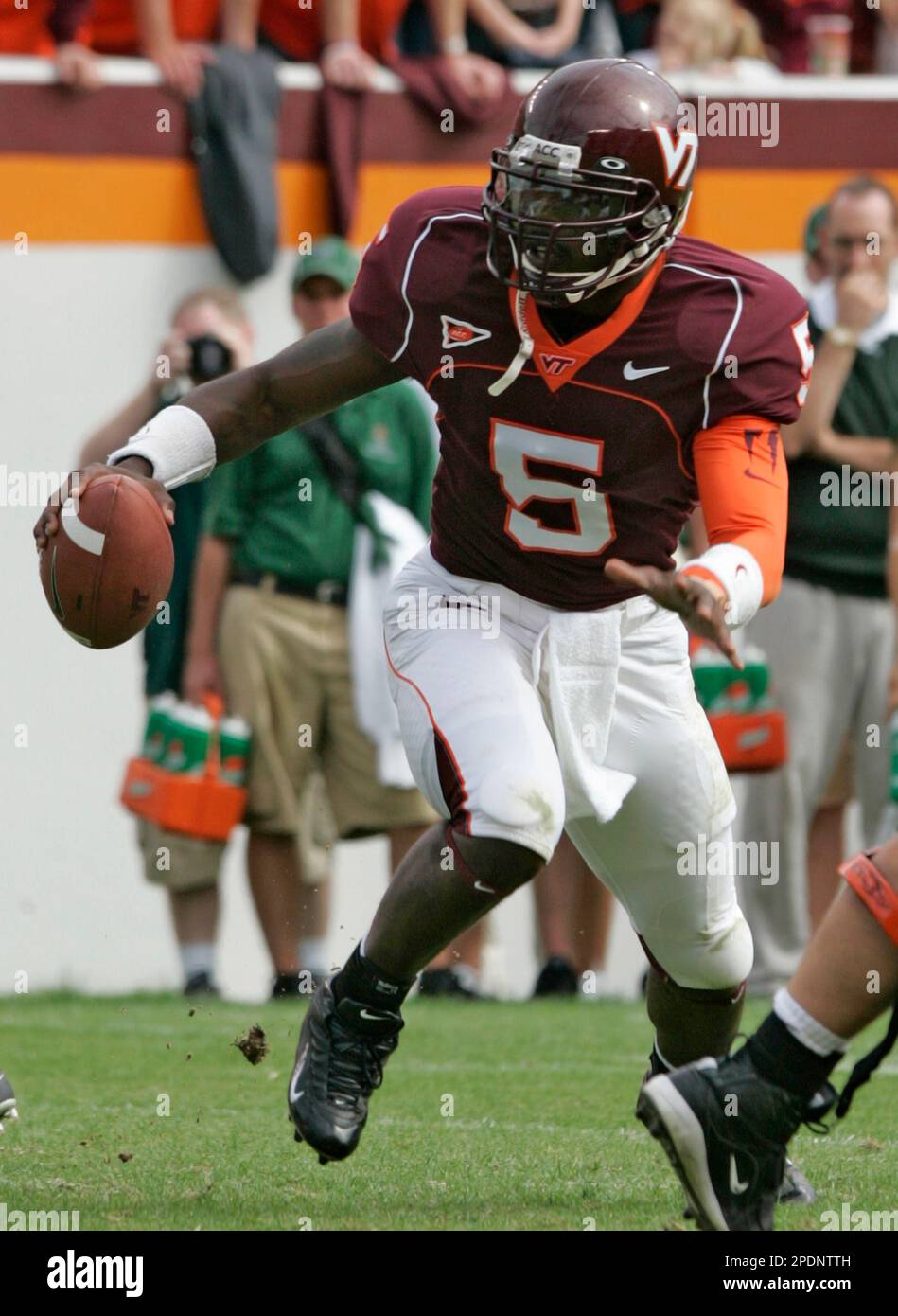 Virginia Tech quarterback Marcus Vick (5) looks for running room ...