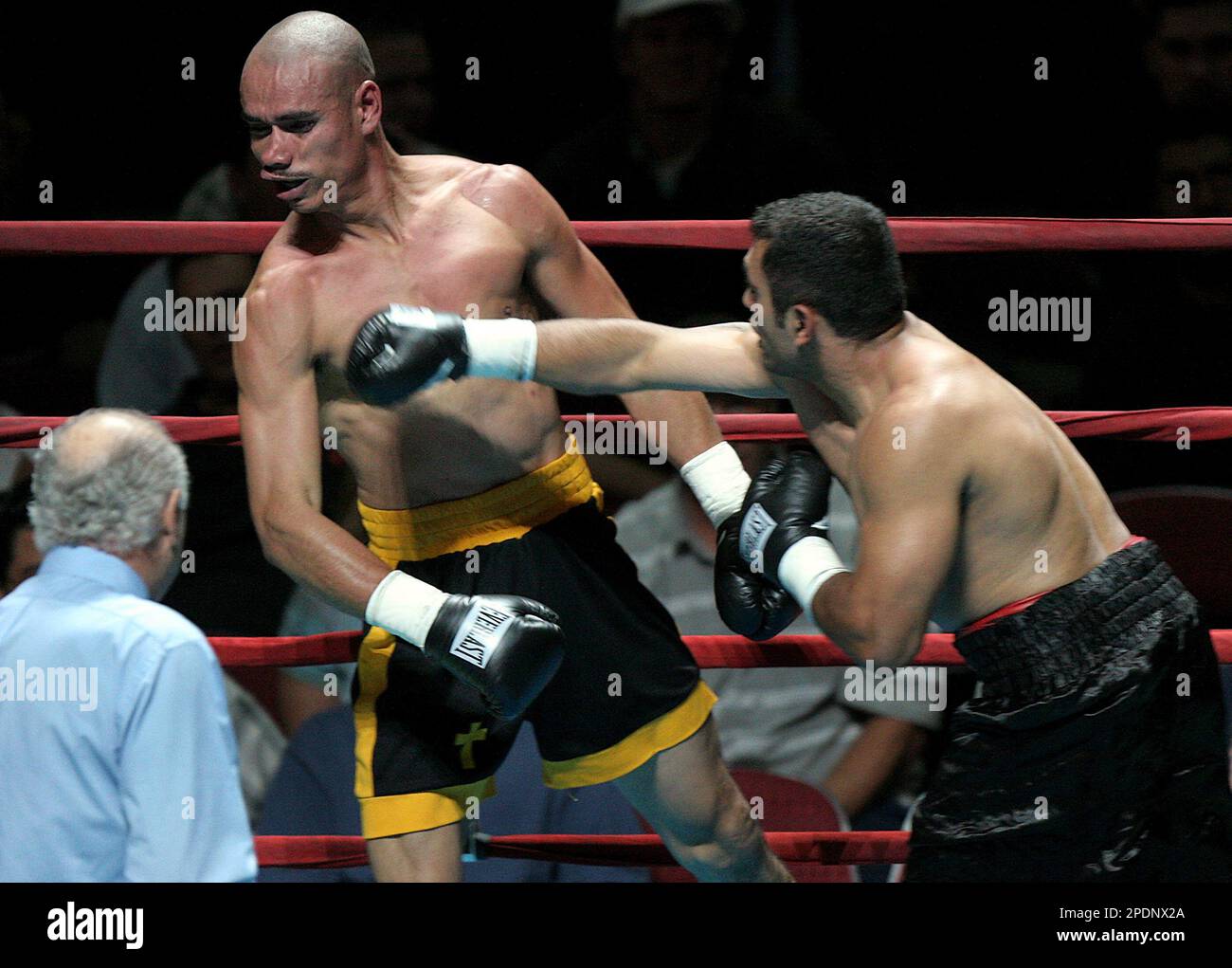Oscar Montano, of Mexico, is sent reeling by a right cross from Arturo ...
