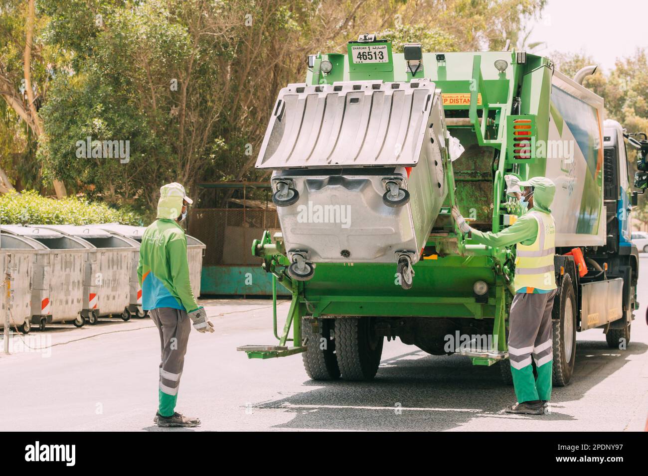 Dubai, UAE, United Arab Emirates - May 25, 2021: Worker of municipal ...
