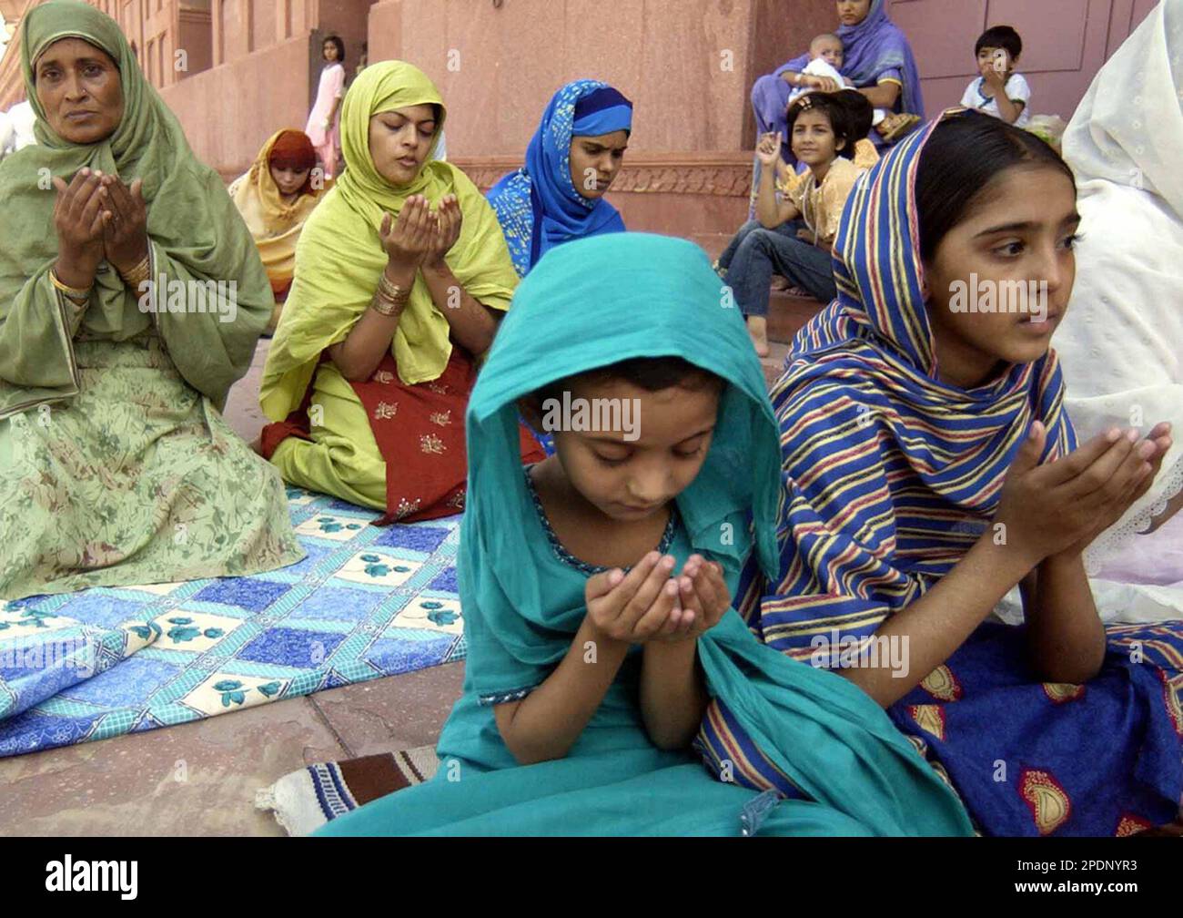 Pakistani Muslims offer Friday prayers during the Islamic holy month of ...