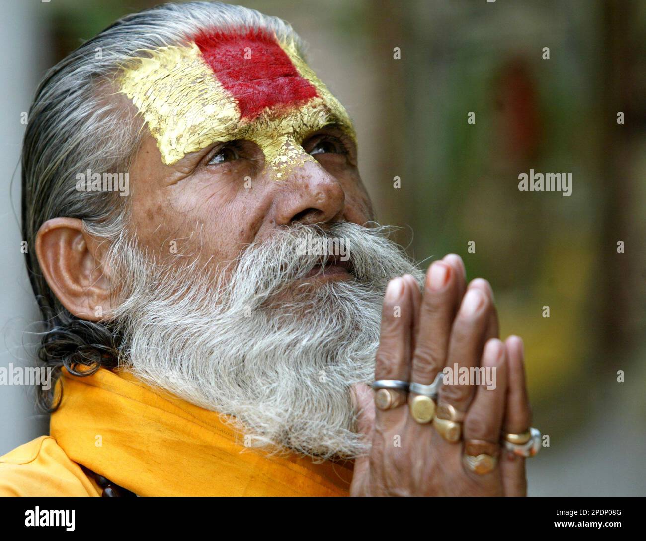 Mahant Ramdas, an Indian Sadhu, or Hindu holy man, offers prayers to ...