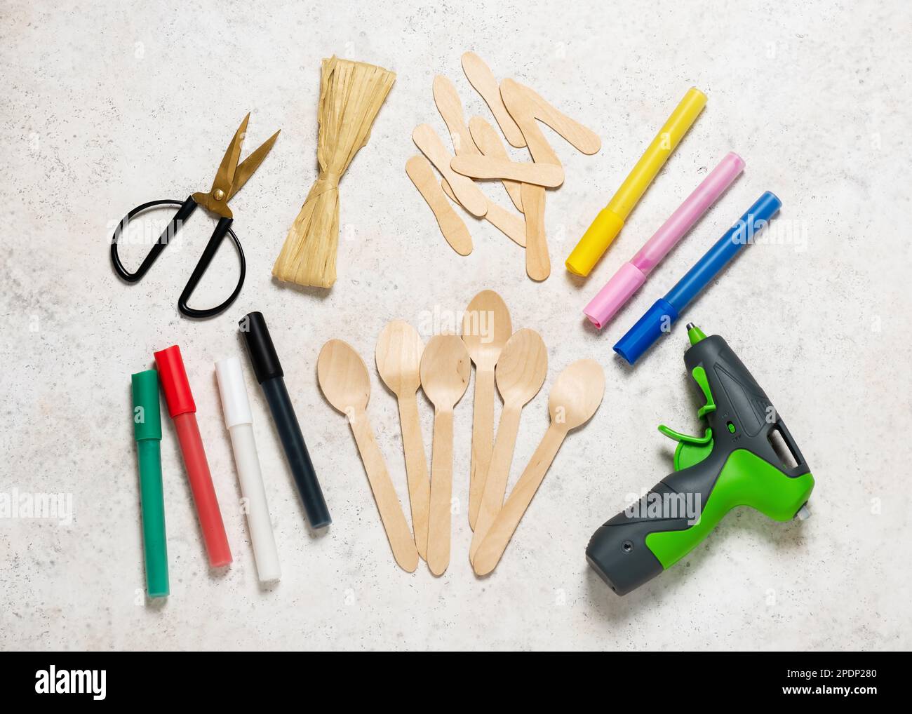 Top view of craft workplace with wooden spoons and ice cream spades ...