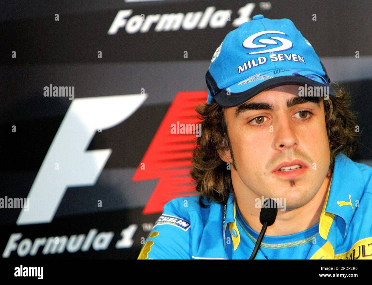 Spanish Renault driver Fernando Alonso speaks during a press conference ...