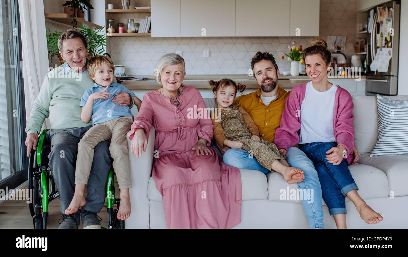 Portrait of happy multigenerational family in modern house Stock Photo ...