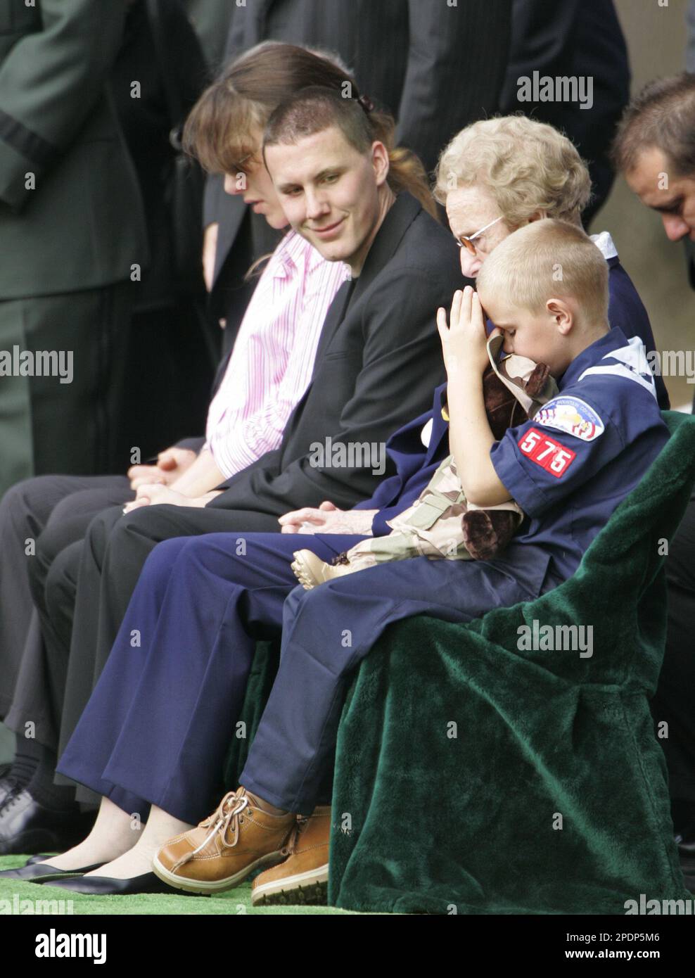 David Allers, second left, smiles as his nephew, Gregory Allers, 8 ...