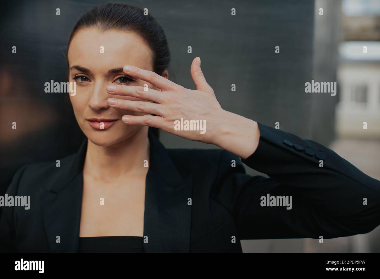 Fashion street style portrait of pretty girl in black suit. Beautiful ...