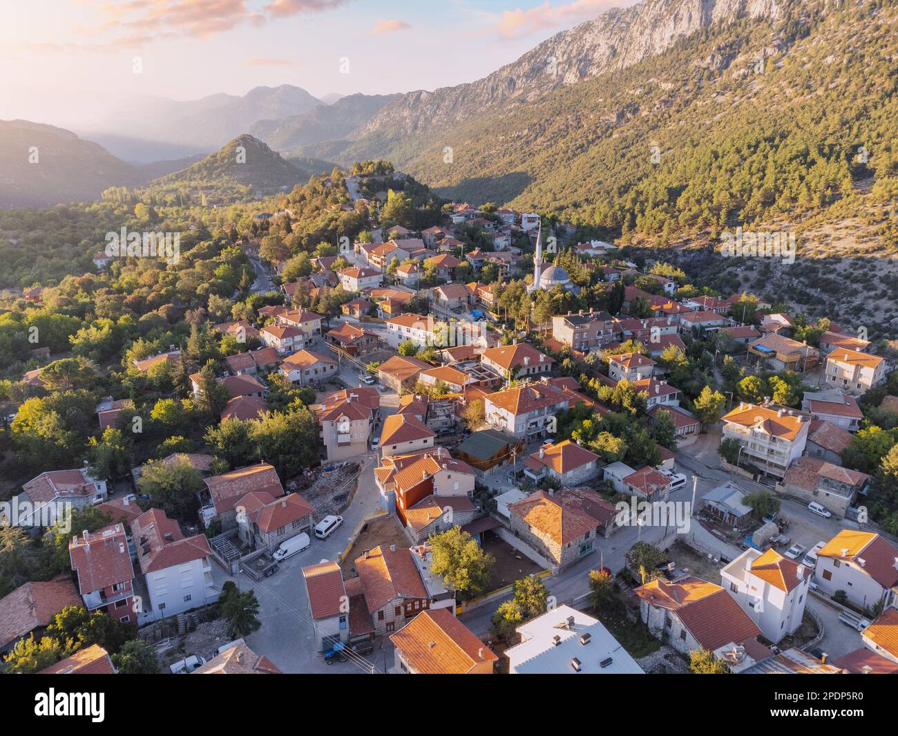 From above, turkish Ormana village colorful houses and vibrant gardens ...