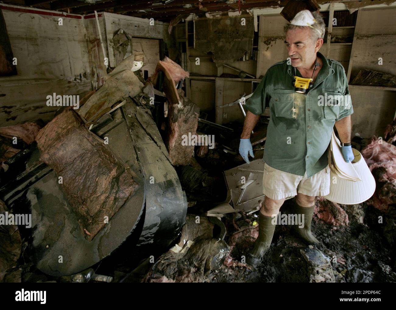 Ben Bagert, Jr. looks through his flood-damaged home in the Lakeview ...