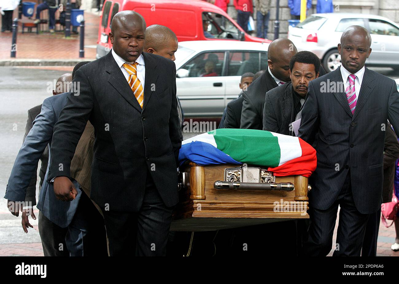 South African mining tycoon Brett Kebbel's coffin is carried into St ...