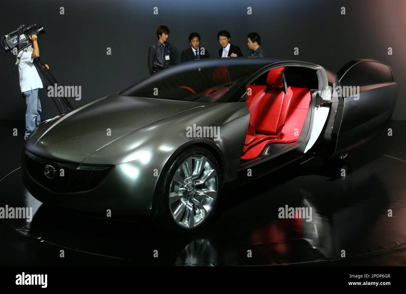 Reporters ask questions about Mazda Motor Corp.'s concept car "Senku ...