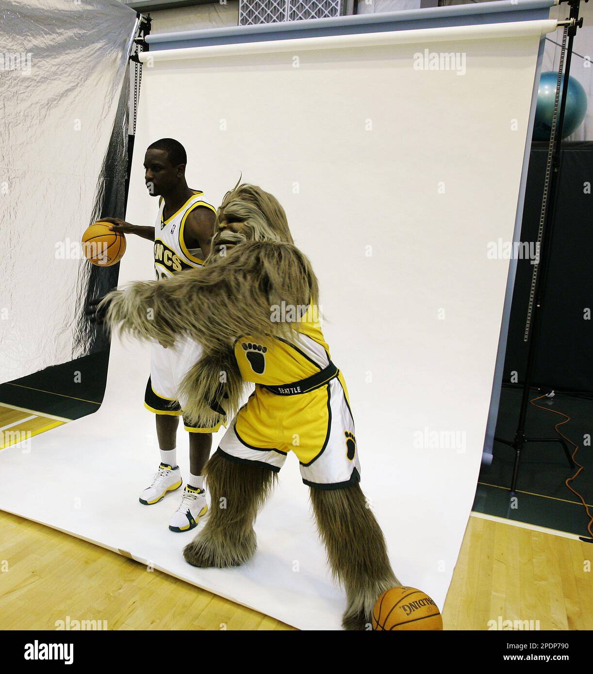 Squatch, the Seattle SuperSonics mascot, jumps in and tries to steal ...