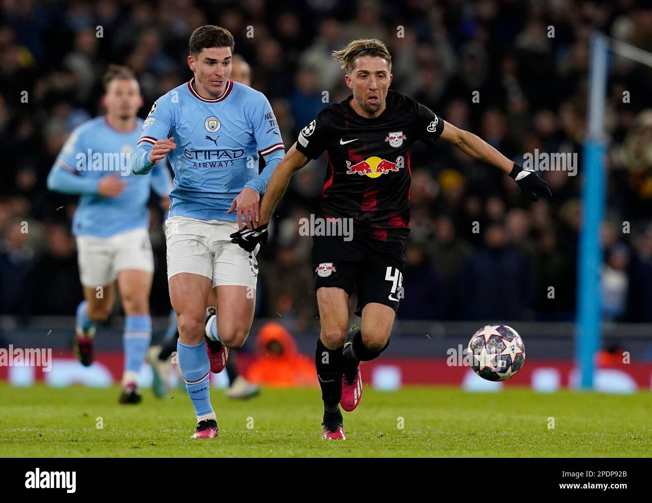 Manchester, UK. 14th Mar, 2023. Kevin Kampl of RB Leipzip (R) is challenged by Julian Alvarez of ...