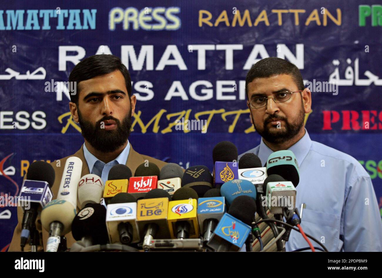 Palestinian Hamas spokesmen Mosheer Al-Masri, left, and Sami Abu Zuhri ...