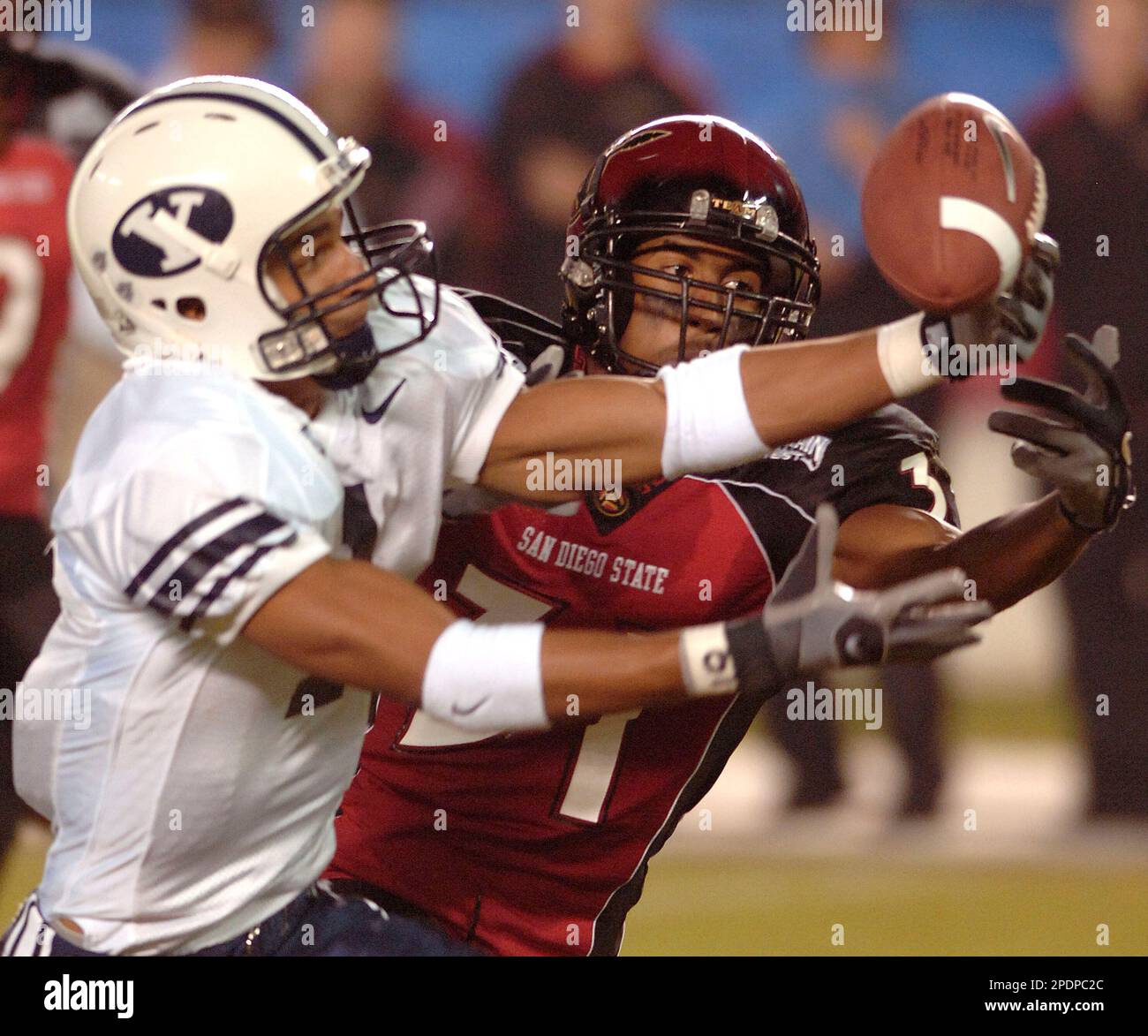 Brigham Young receiver Todd Watkins (1) fights for the ball with San ...
