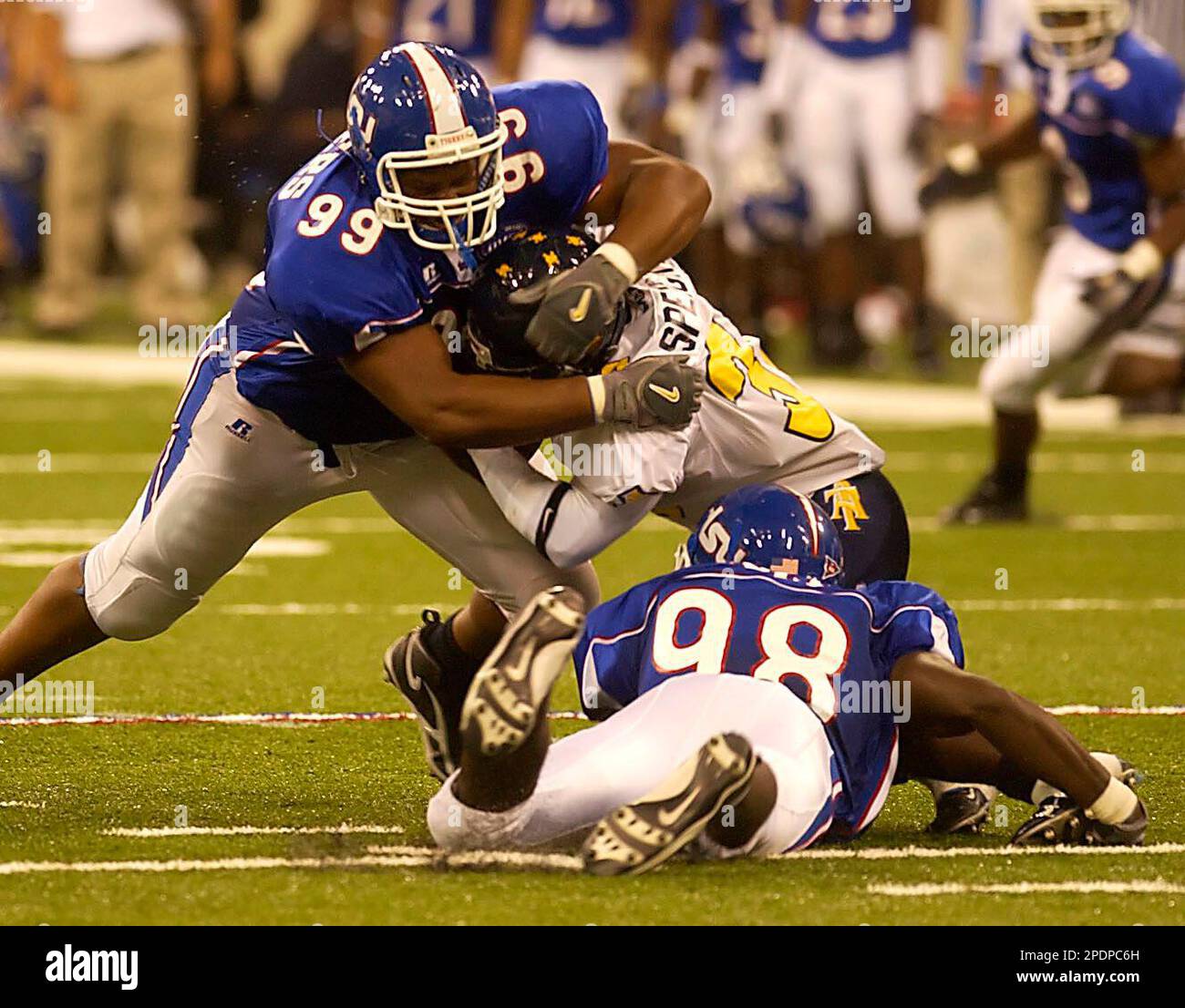 Tennessee State's Almonte Duncan (99) and Jonathon Edwards (98) wrap up ...