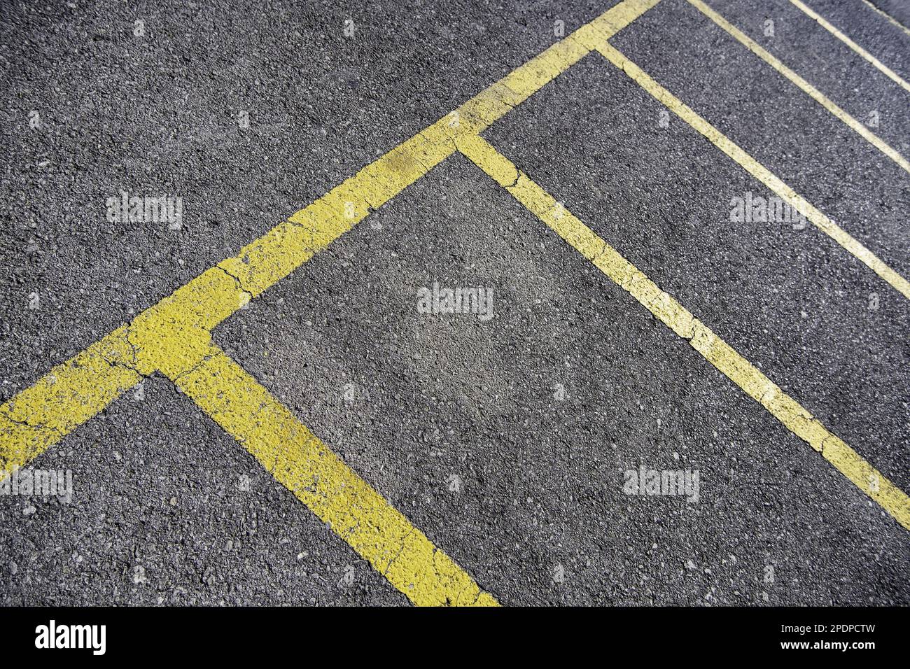 Detail of yellow lines in a parking lot in the city, public parking ...
