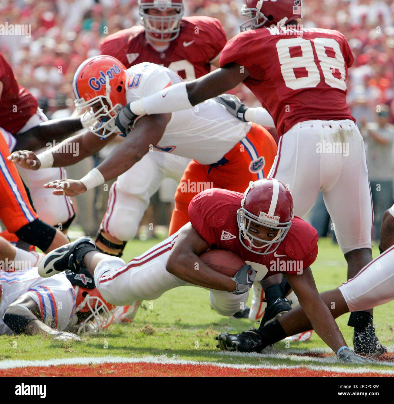 Alabama running back Tim Castille, bottom, crosses the goal to score ...