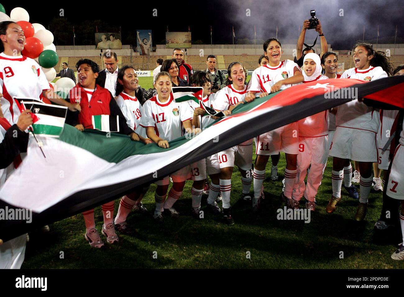 Jordanian Women Soccer team members celebrate winning the final match ...