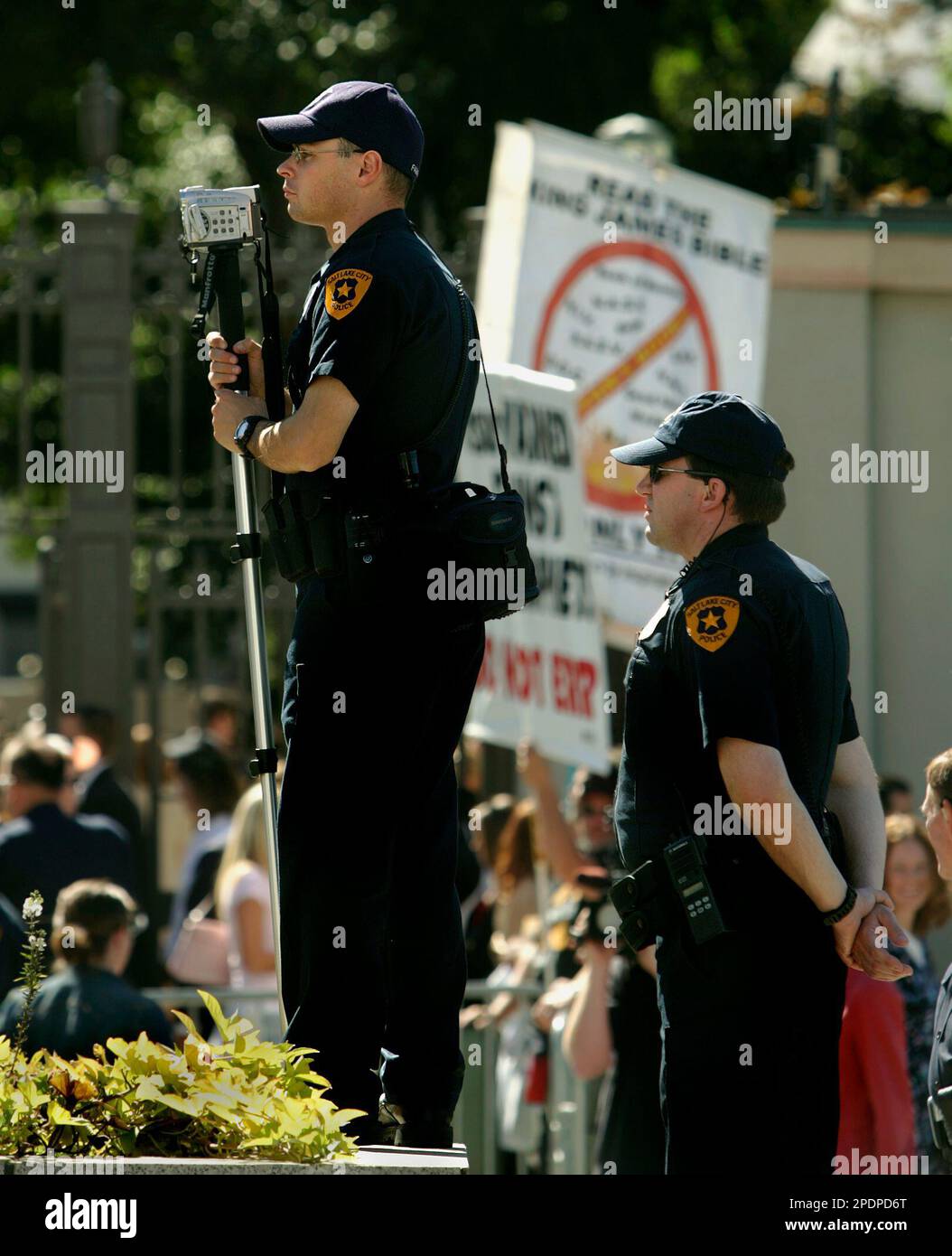 Salt Lake City police officers Chris Fairall, left, and W. Silver keep ...