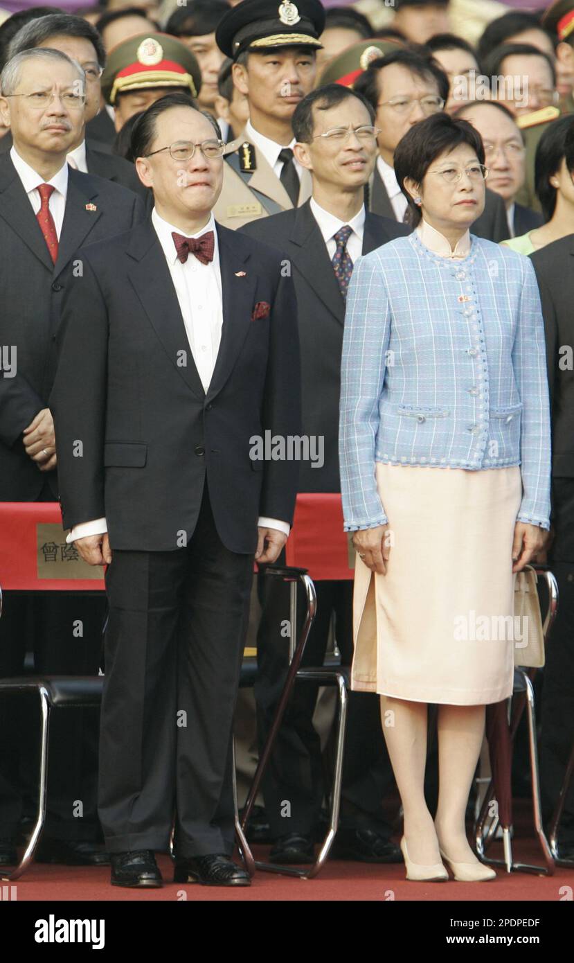 Hong Kong Chief Executive Donald Tsang, left, and his wife Salina ...