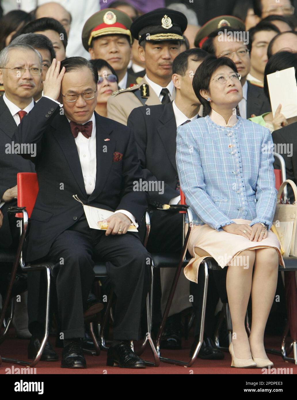 Hong Kong Chief Executive Donald Tsang, left, and his wife Salina ...