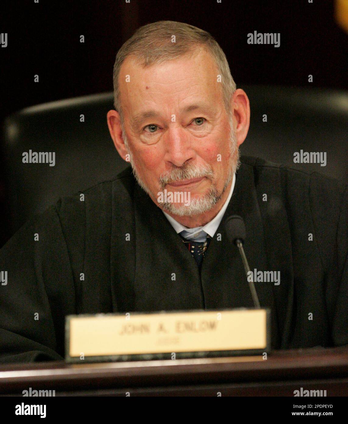 Portage County Common Pleas Judge John A. Enlow listens to opening ...