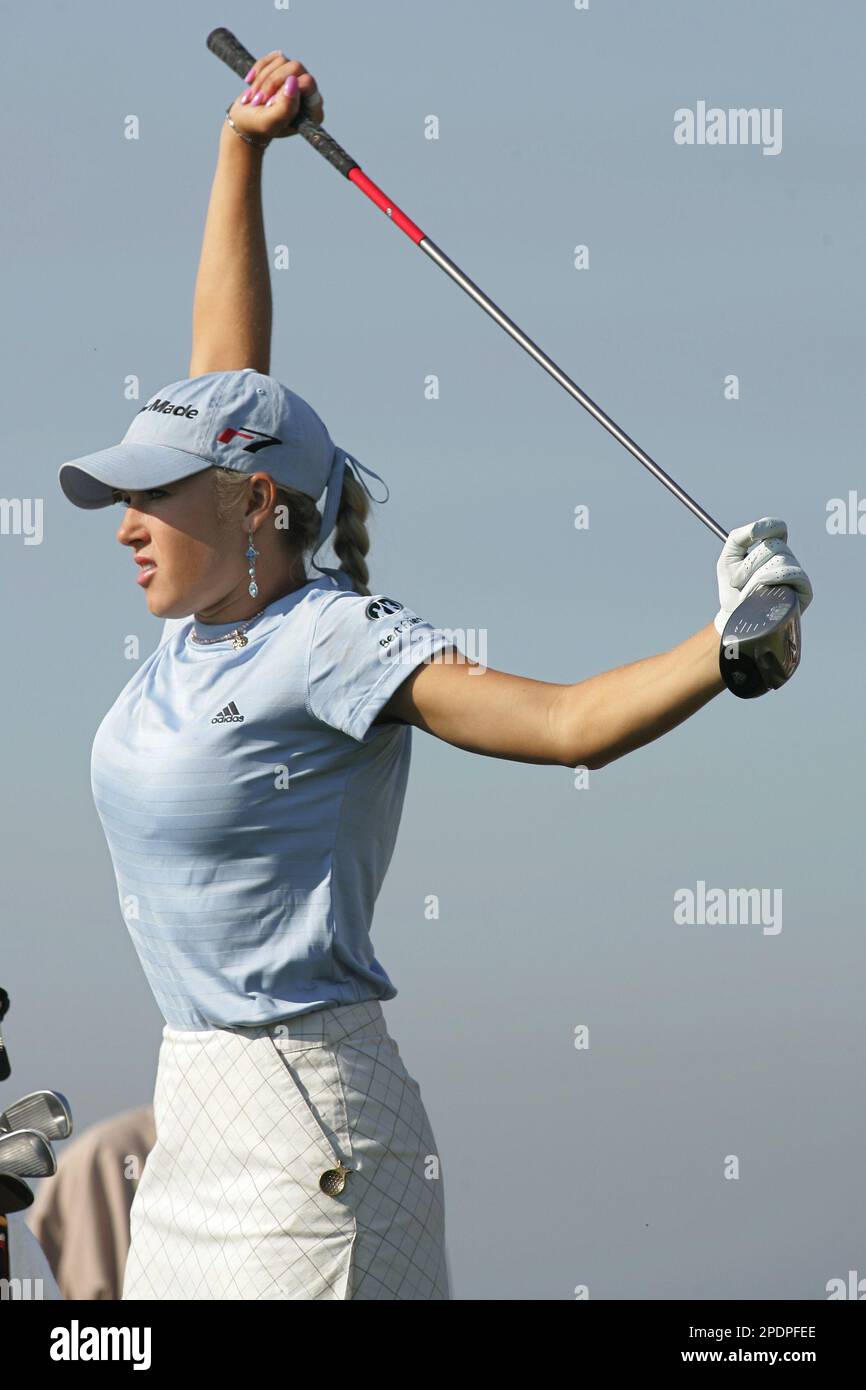 Golfer Natalie Gulbis stretches prior to teeing off on the 12th hole ...