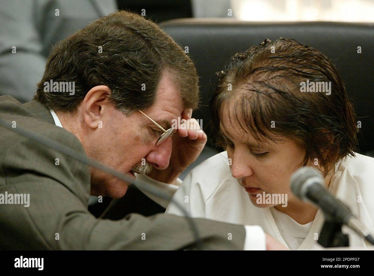 Jennifer Hyatte, right, listens to her attorney John Eldridge during ...