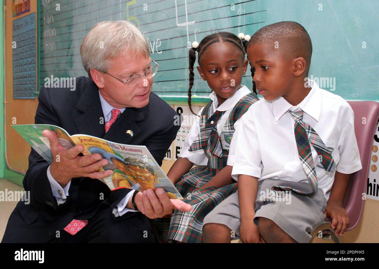 U.S. Ambassador John Rood reads the book "Jonathan and His Mommy" to ...