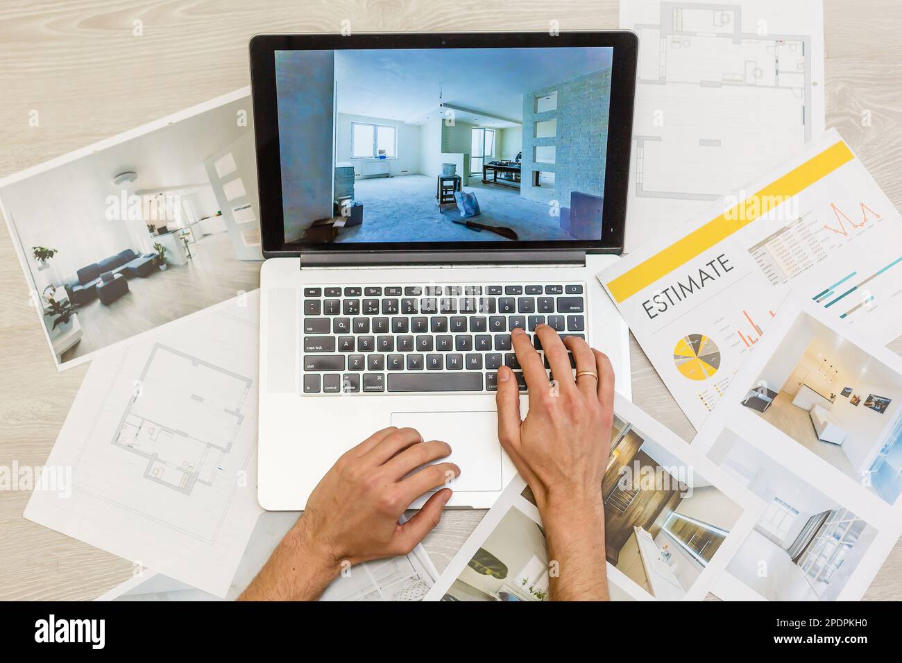 top view of Designer hand working with laptop computer on wooden desk as responsive web design ...