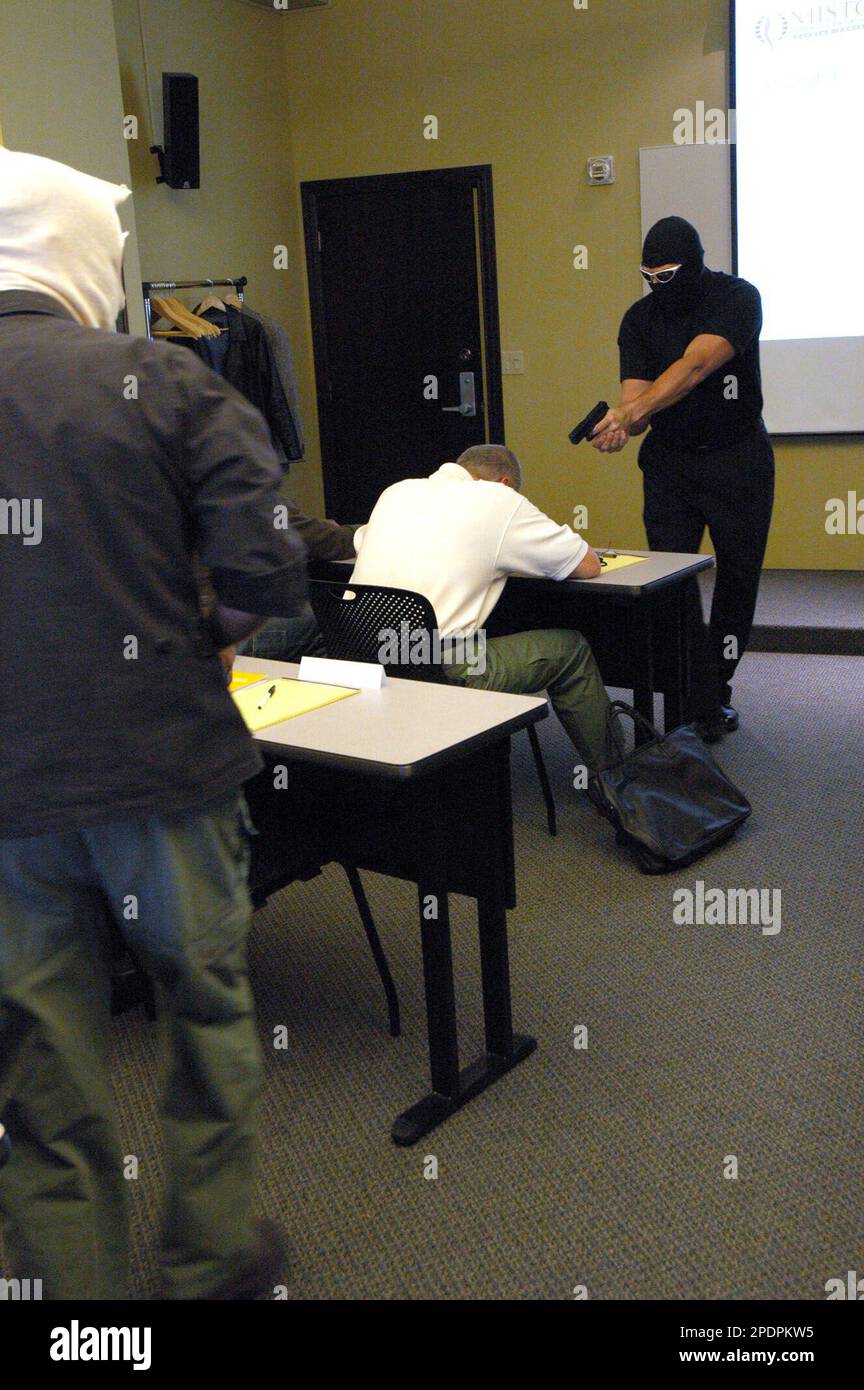 ** ADVANCE FOR MONDAY, OCT. 3 **A gunman points a weapon at a hostage ...