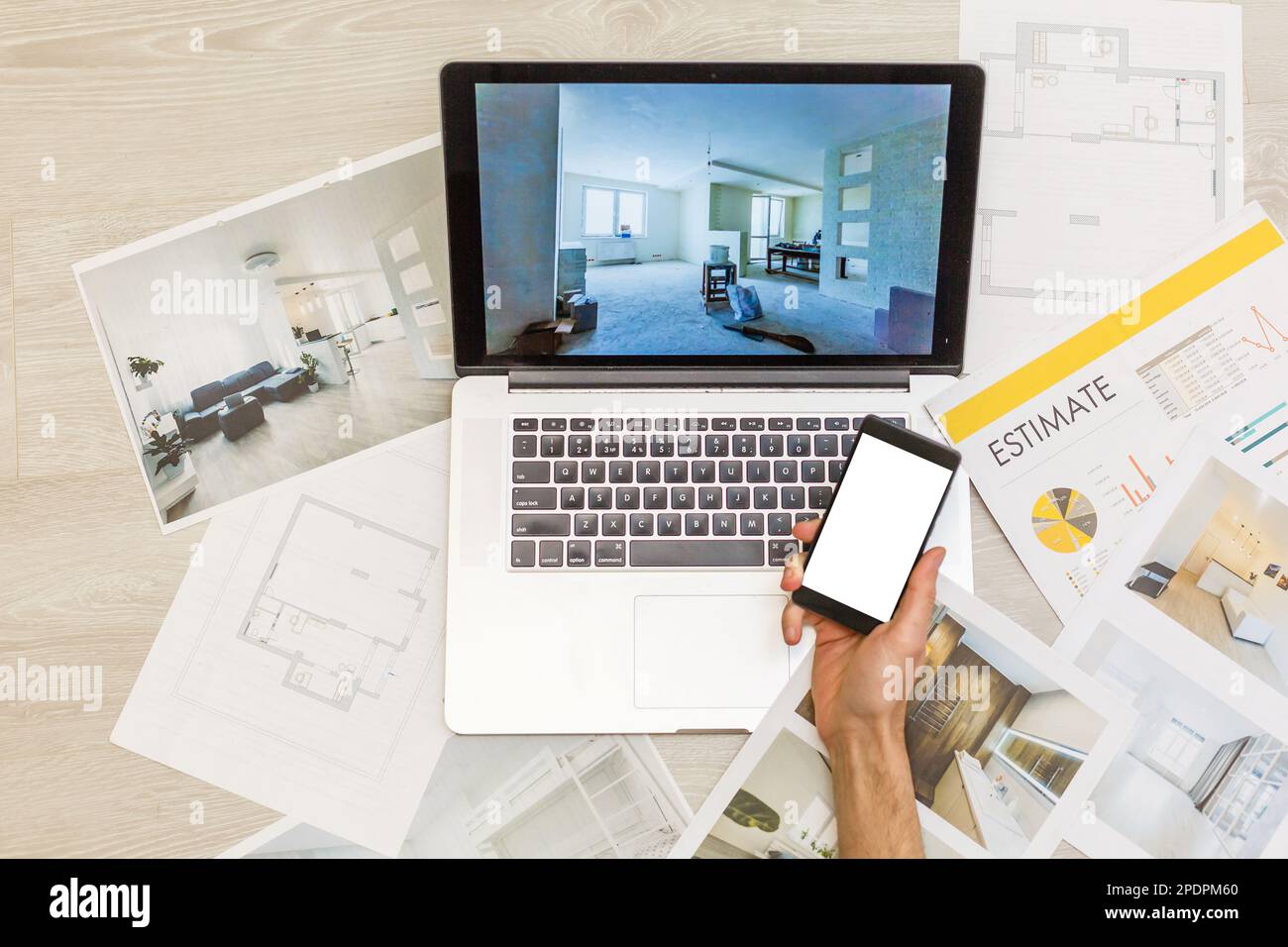 top view of Designer hand working with laptop computer on wooden desk as responsive web design ...
