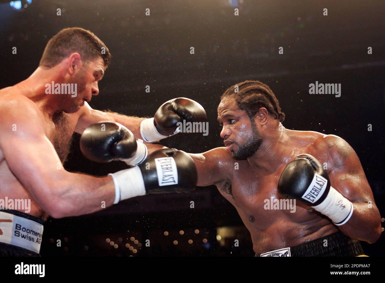 WBO heavyweight champion Lamon Brewster of the U.S., right, lands a ...