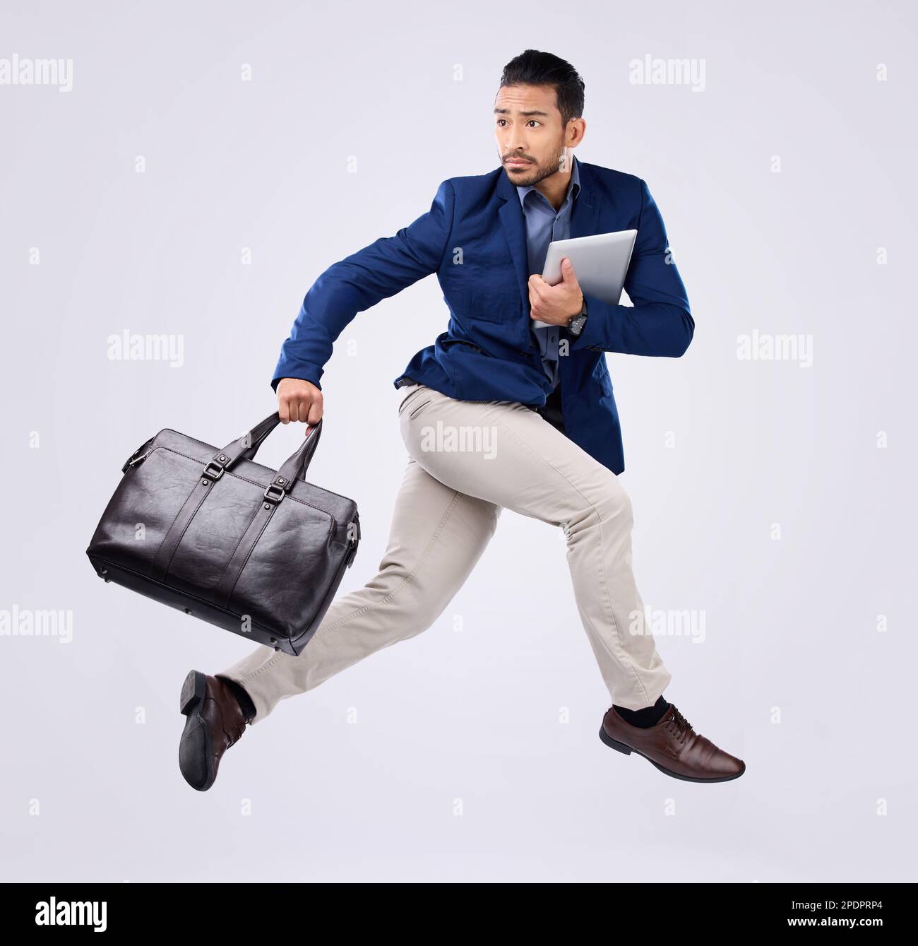 Hurry, work and an Asian man jumping for business isolated on a white ...