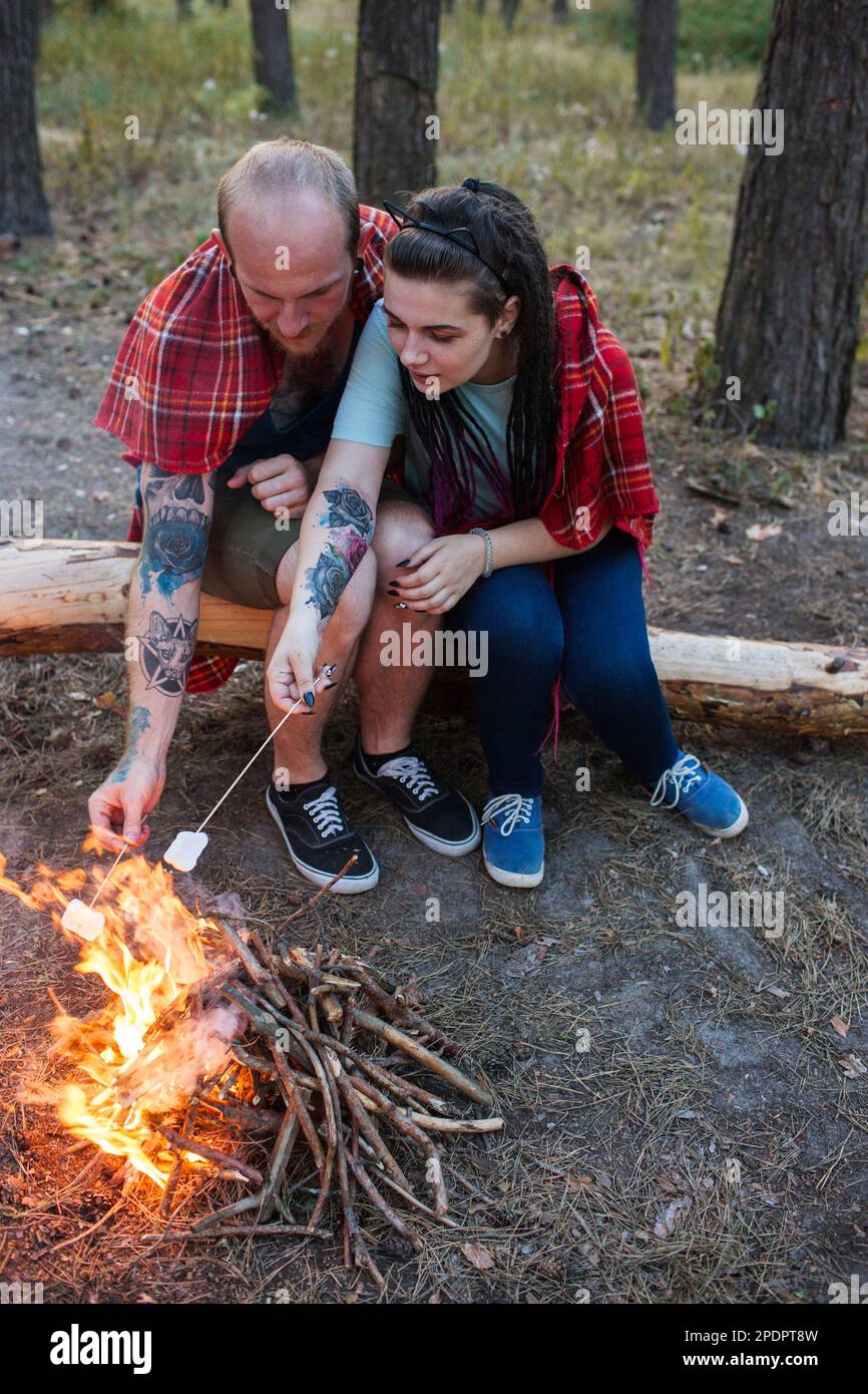 Couple love nature picnic bonfire forest concept Stock Photo - Alamy